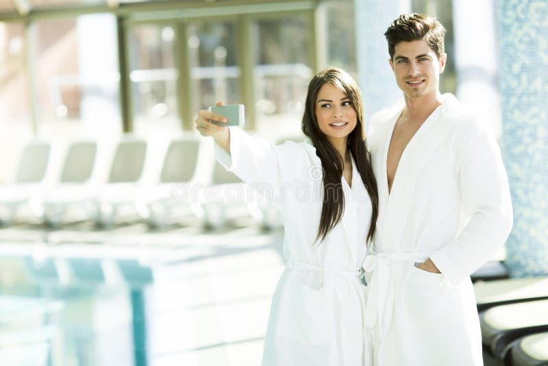 Young couple by the pool stock image. Image of people - 77064521