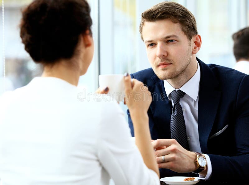 Young Couple of Professionals Chatting during Coffee Break Stock Image ...