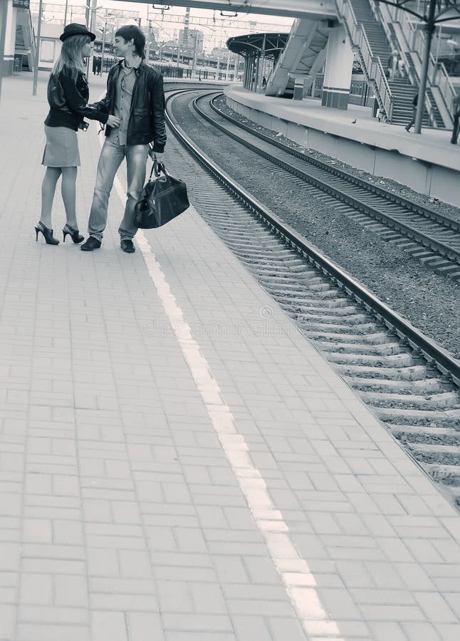 Young Couple on Railway Station Stock Photo - Image of couple ...