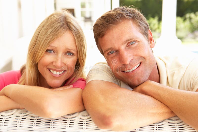 Young Couple Relaxing Together on Sofa Stock Photo - Image of relaxing ...