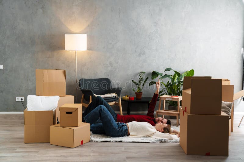 Young Couple Resting while Moving Stock Image - Image of moving ...