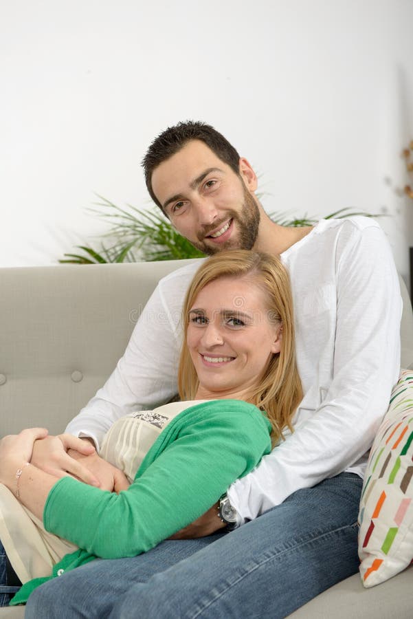 Young Couple Resting in the Sofa Stock Photo - Image of leisure, relax ...