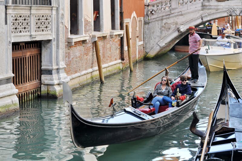 Young Couple Ride In A Gondola In Venice Editorial Photography Image