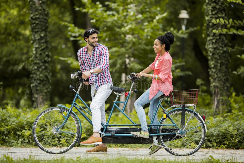 Young Couple Riding on the Tandem Bicycle Stock Photo - Image of cycle ...