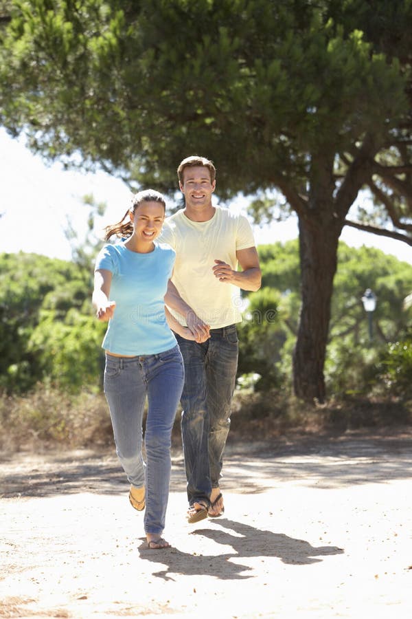 Young Couple on Romantic Walk in Countryside Stock Photo - Image of ...
