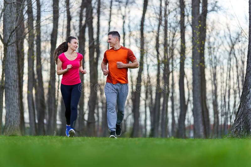Young Couple Running in the Park Stock Photo - Image of jogging ...