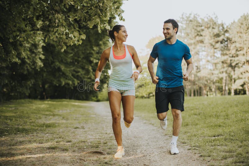 Young couple running stock photo. Image of athletic - 115600318