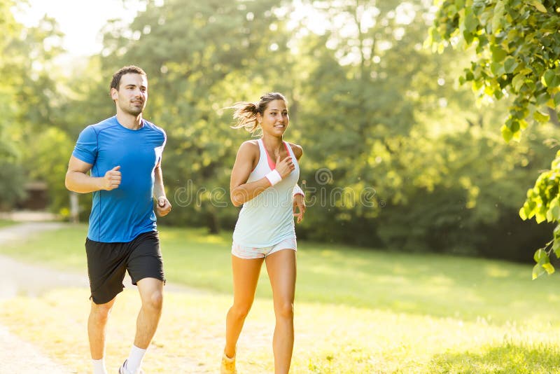 Young couple running stock image. Image of male, nature - 74205999