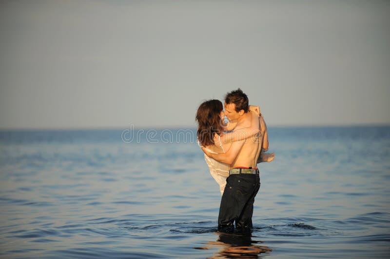 Young couple in the sea stock image. Image of love, happy - 22800083