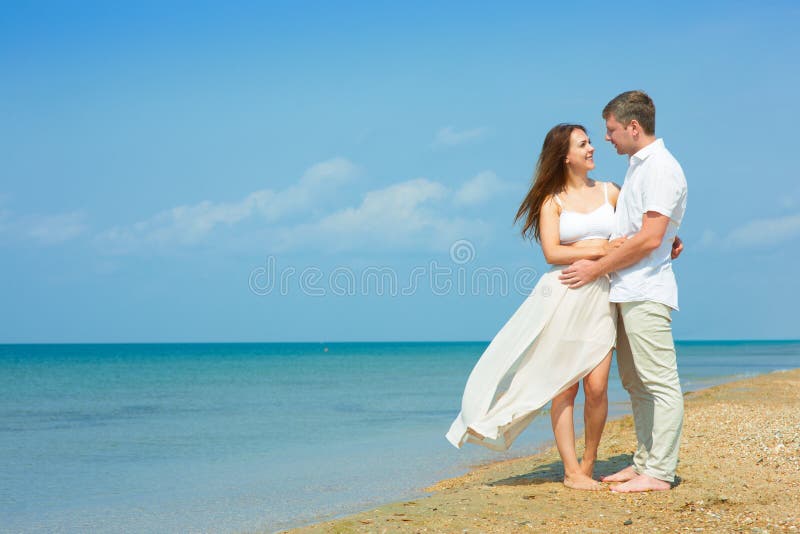 Young couple by the sea stock photo. Image of together - 74159946