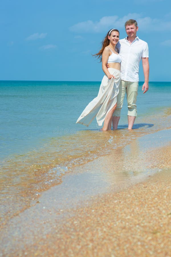 Young couple by the sea stock image. Image of people - 74159983