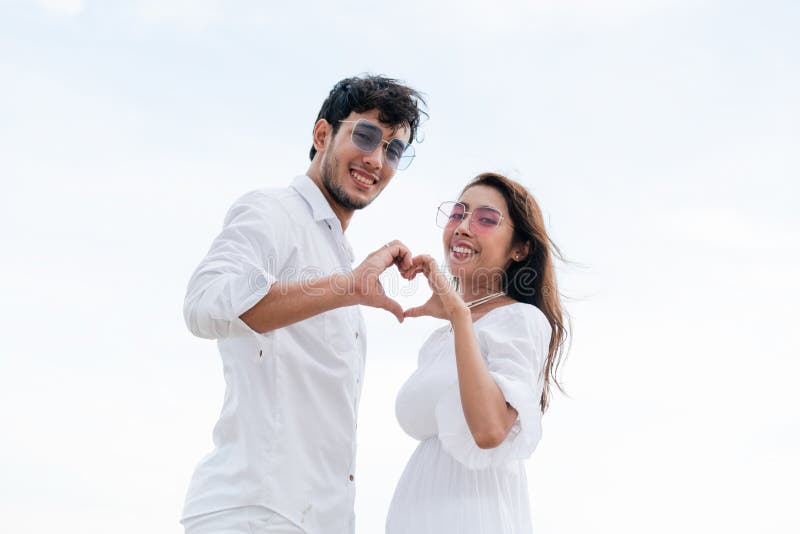 Young Couple Shows Heart Shape Hand Gesture. Stock Image - Image of ...