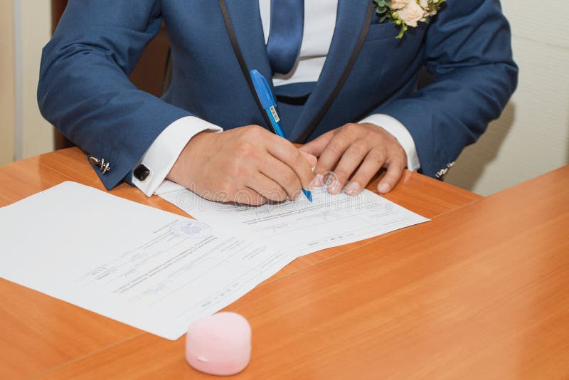 Young Couple Signing Wedding Documents. Stock Photo - Image of beauty ...