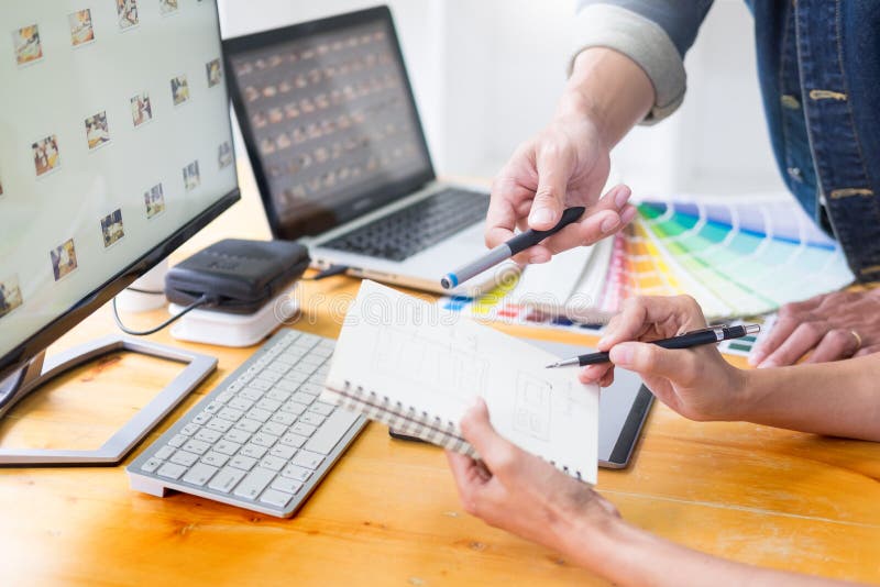 Young Couple Sitting at the Table and Working Together of Creative ...
