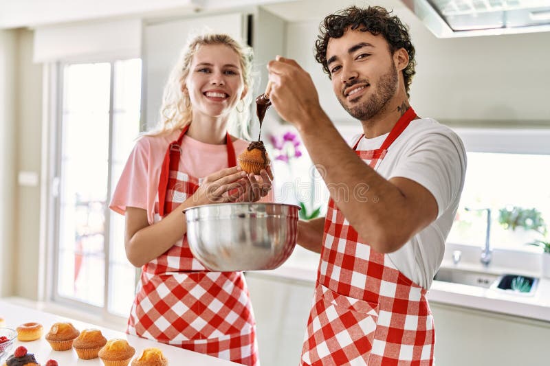 Young Couple Smiling Happy Cooking Sweets at Kitchen Stock Photo ...