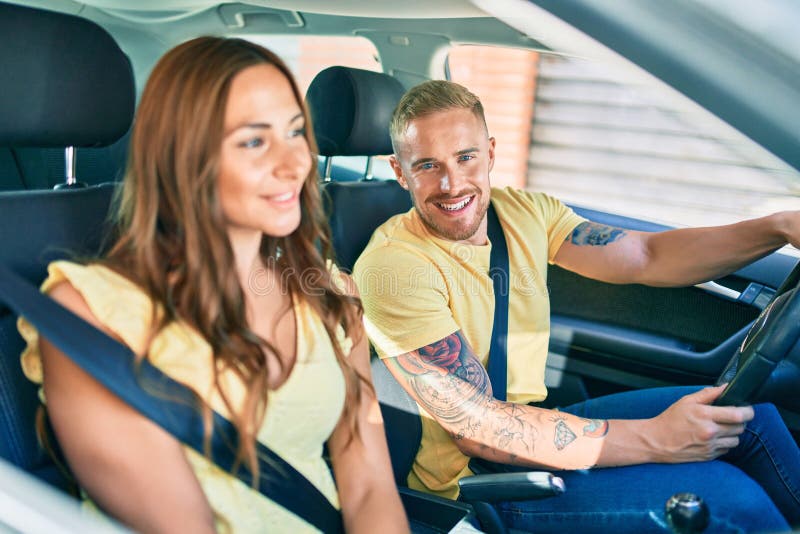 Young Couple Smiling Happy Driving Car Stock Photo - Image of positive ...