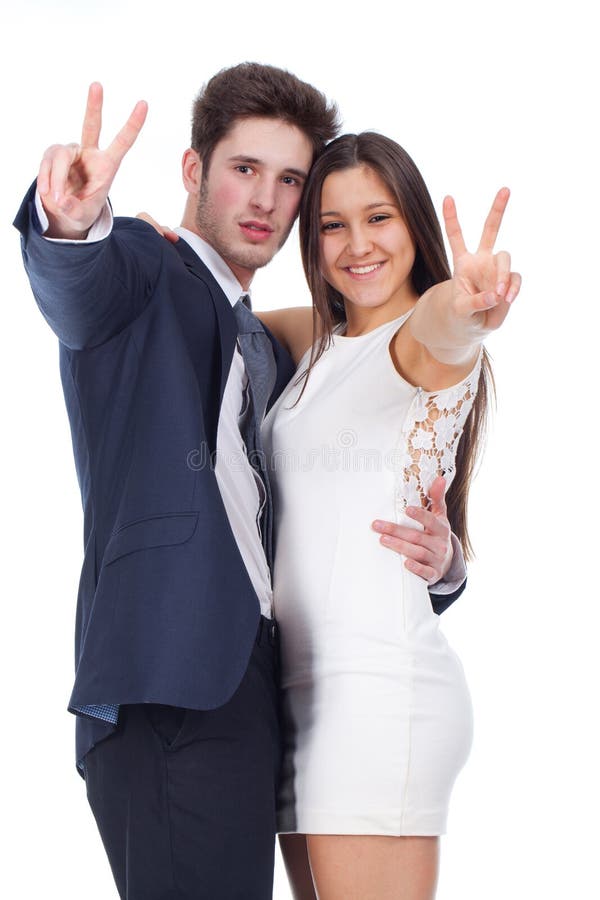 Young Couple Smiling with Victory Gesture Stock Photo - Image of ...