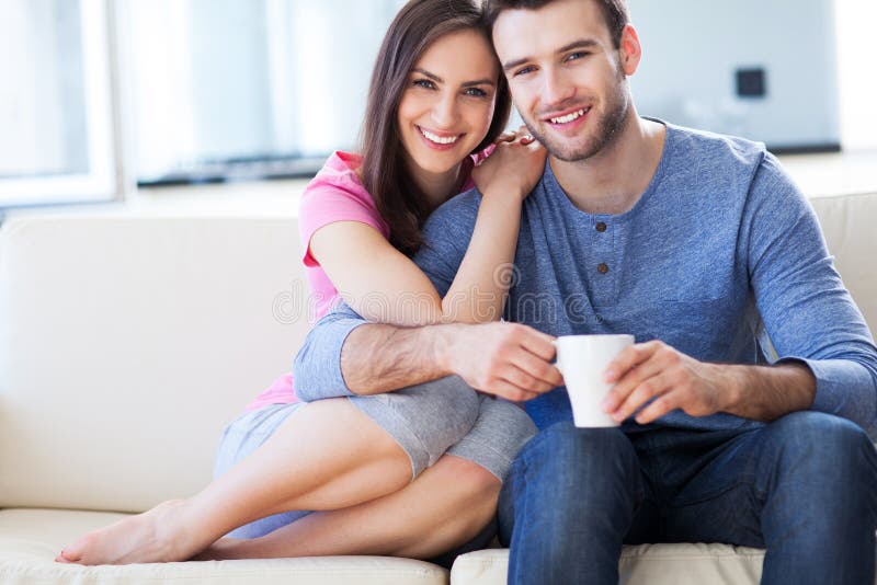 Young couple on sofa stock photo. Image of people, happy - 30630366