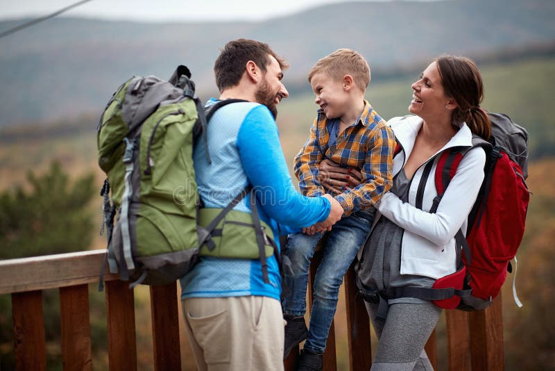 Young Couple with Son Having Fun on Hiking Stock Photo - Image of ...