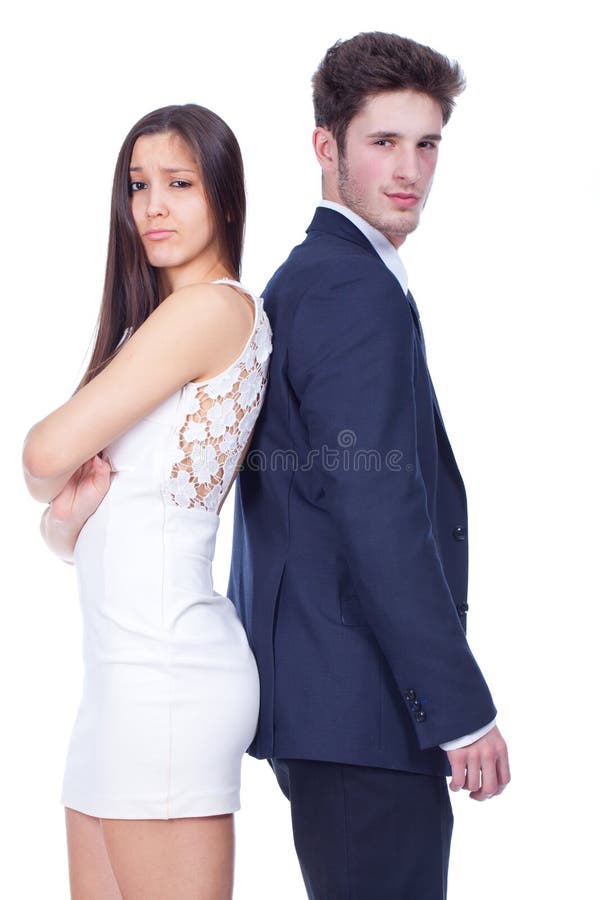 Young Couple Standing Back To Back Stock Photo - Image of isolated ...