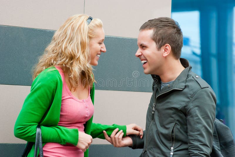 Young Couple Standing and Talking Stock Photo - Image of date, close ...