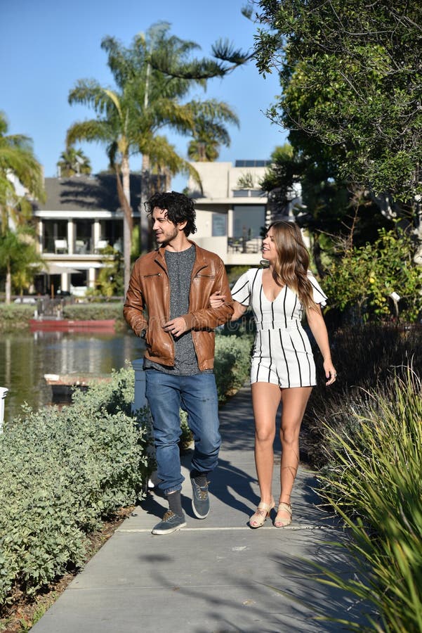 Young Couple Strolling through Beautiful Gardens Stock Photo - Image of ...