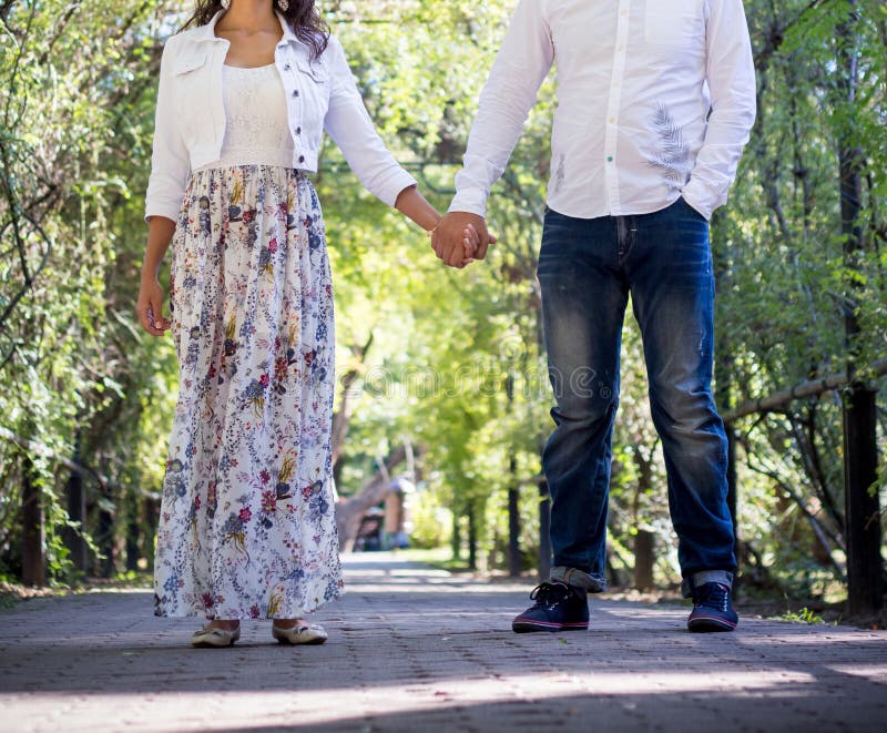 Couple In Love Strolling In A Park Stock Photo - Image of date ...
