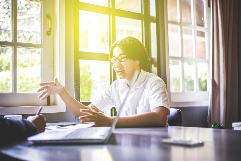 Young Couple Student Discussing Things and Working on a Project Stock ...
