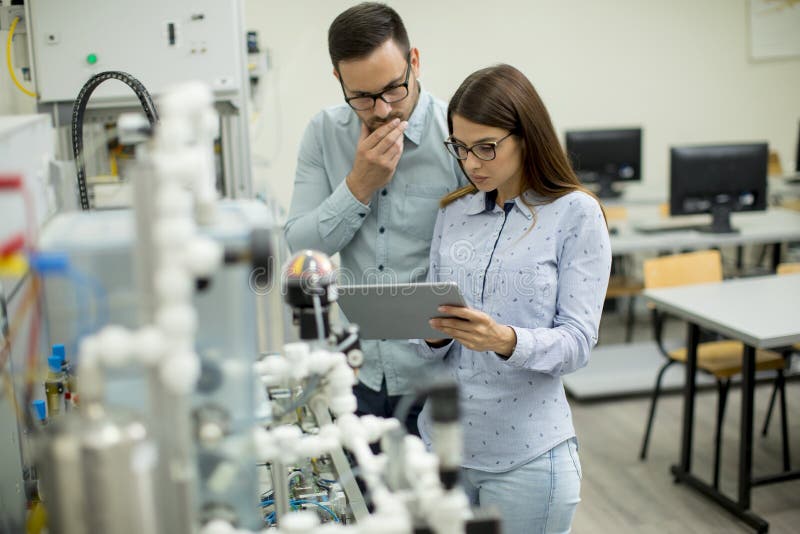 Young Couple of Students at Robotics Lab Stock Photo - Image of ...