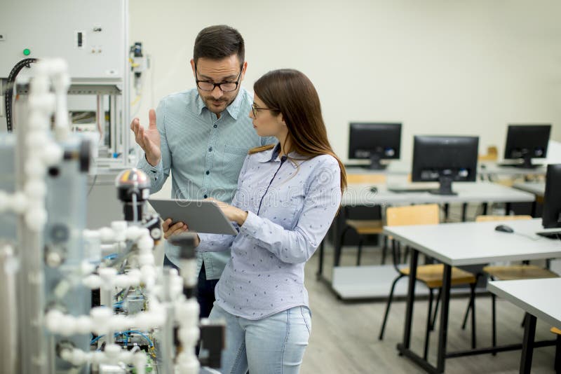 Young Couple of Students at Robotics Lab Stock Photo - Image of ...