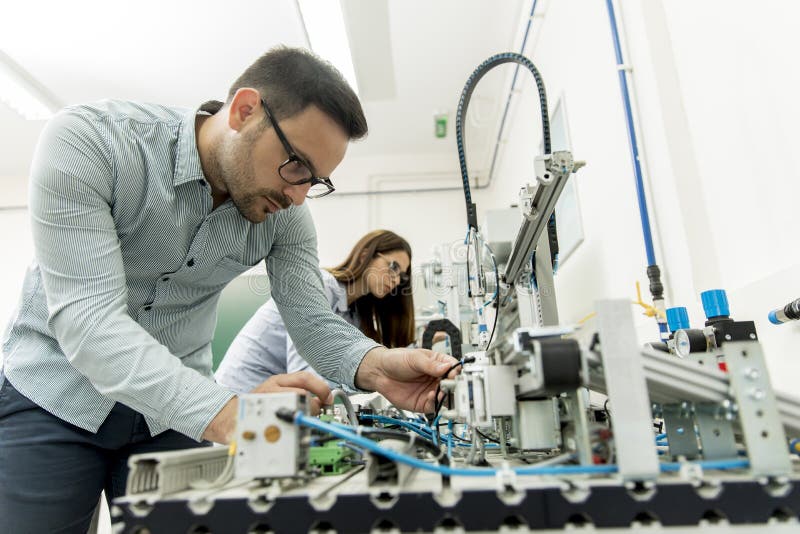 Young Couple of Students at Robotics Lab Stock Image - Image of ...