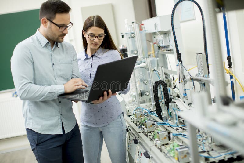 Young Couple of Students at Robotics Lab Stock Photo - Image of ...