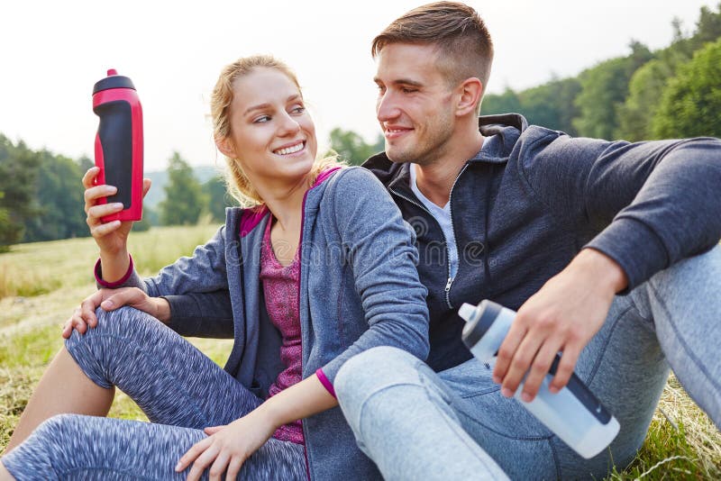 Young Couple Taking a Break Stock Photo - Image of hiking, summer: 95575046