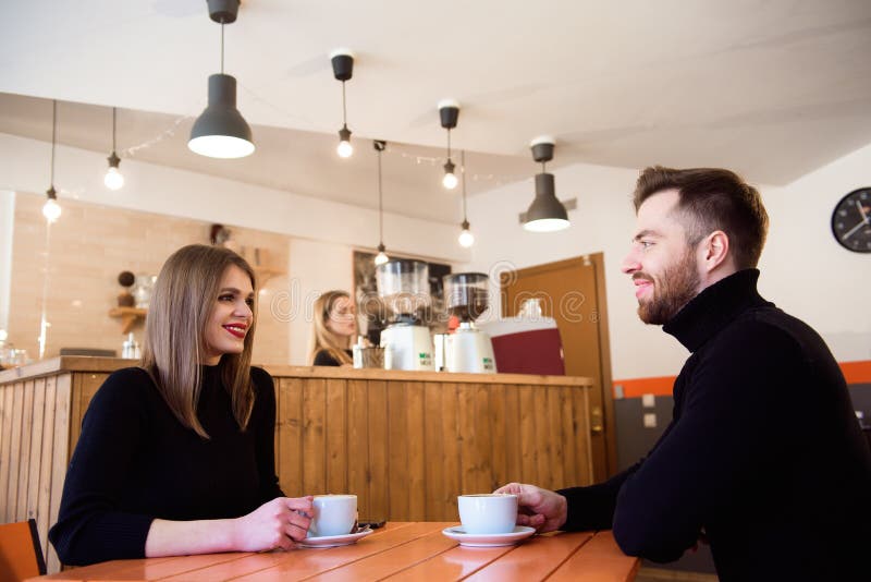 Young Couple Talking in a Coffee Shop Stock Image - Image of happy ...