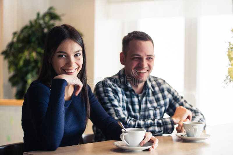 Young Couple Talking in Coffee Shop Stock Image - Image of love, coffee ...