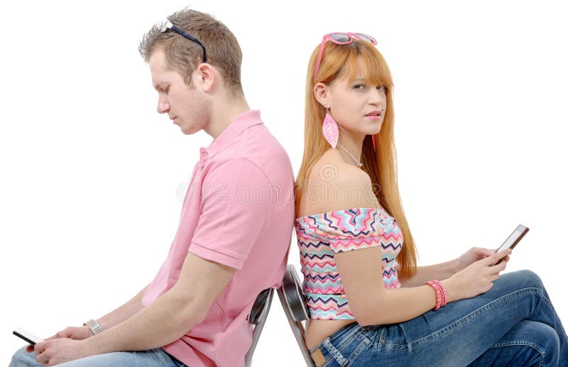 Young Couple Talking on Mobile Phones Sitting Back To Back. Stock Image ...