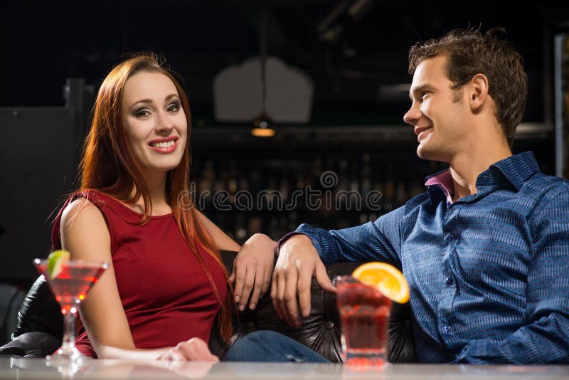 Young Couple Talking in a Nightclub Stock Photo - Image of night ...