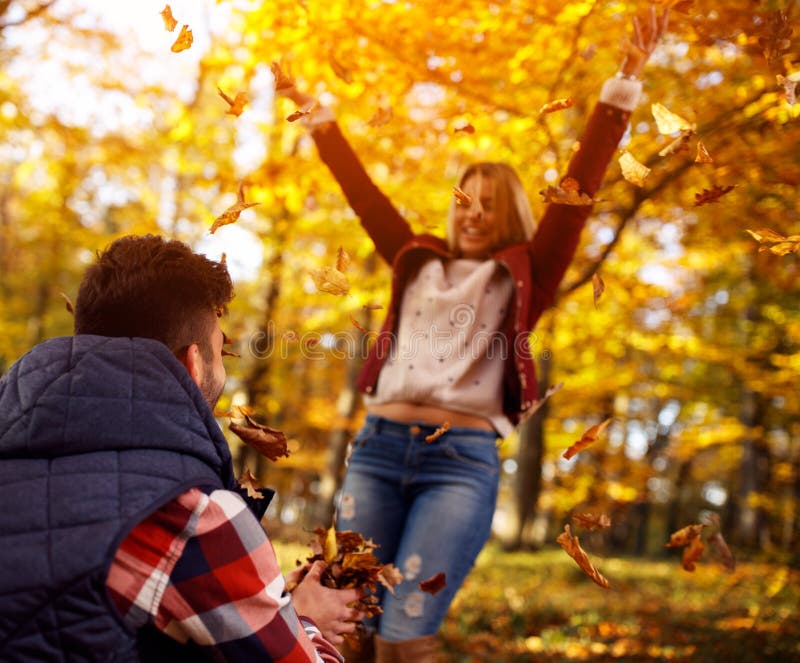 Couple Throwing Fall Leaves Stock Image - Image of lifestyle, adult ...