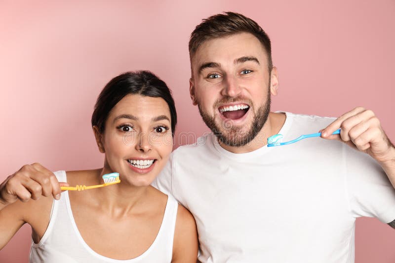 Couple with toothbrushes stock image. Image of isolate - 15403765