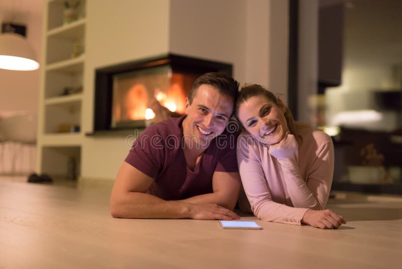 Young Couple Using Digital Tablet on Cold Winter Night Stock Photo ...
