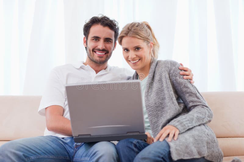 Cheerful Couple Using Laptop Together at Home Stock Photo - Image of ...