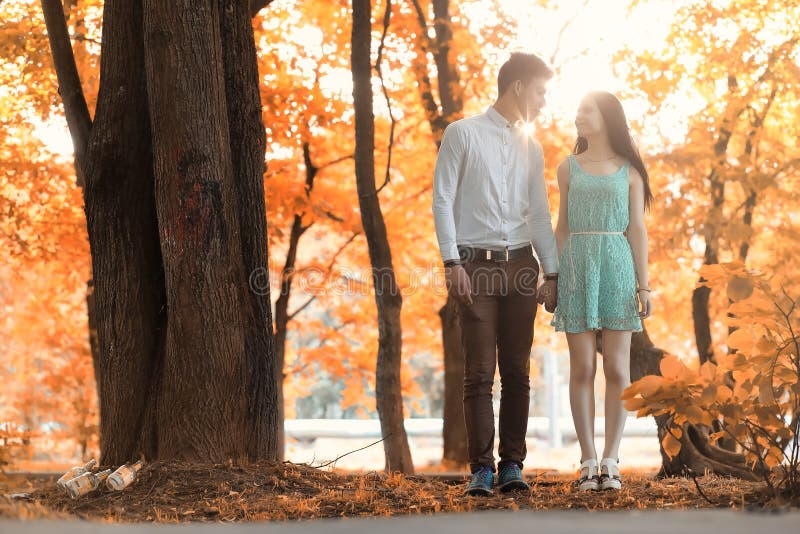 Young Couple on a Walk in Autumn Park Stock Image - Image of lifestyle ...