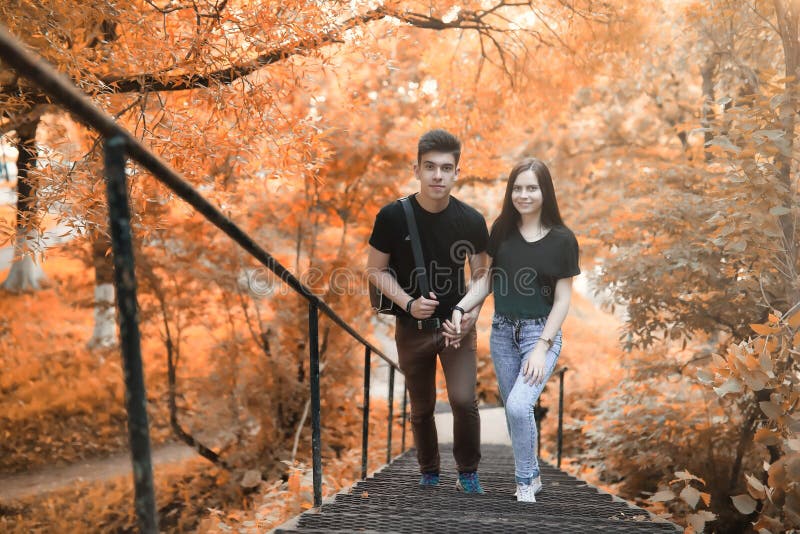 Young Couple on a Walk in Autumn Park Stock Image - Image of park, leaf ...