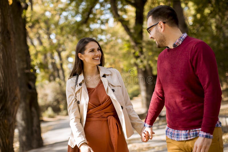 Young Couple Walking in the Autumn Park Stock Photo - Image of ...