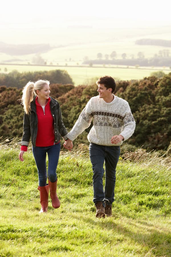 Young Couple Walking in Countryside Stock Photo - Image of enjoying ...