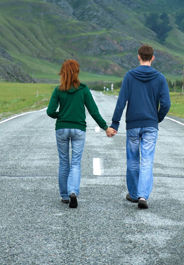 Young couple walking road stock image. Image of caucasian - 38322249