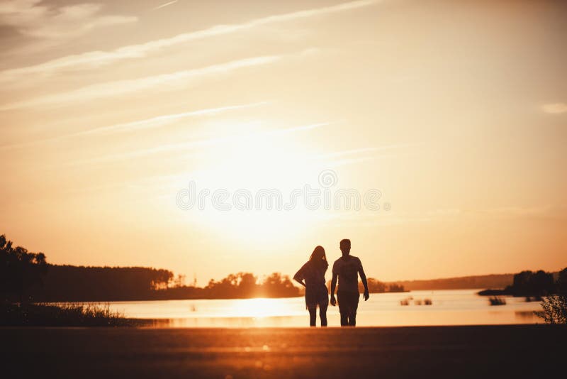 Young Couple Walking on the Road Stock Photo - Image of environment ...