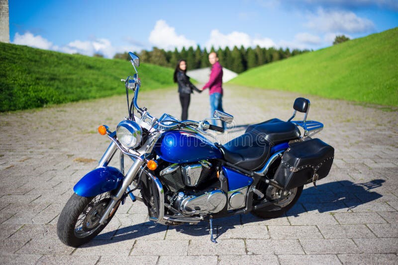 Young Couple Walking on Road and Retro Motorcycle Stock Photo - Image ...