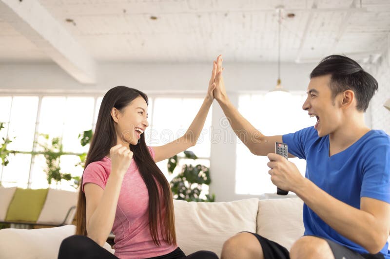 Young Couple Watching Sports Game and Having Fun Stock Image - Image of ...