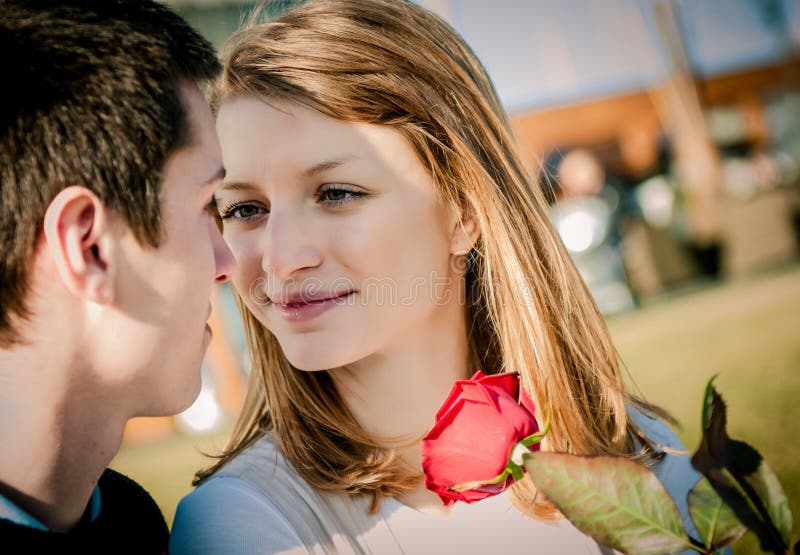 Young Couple - Woman with Red Rose Stock Image - Image of happy, giving ...